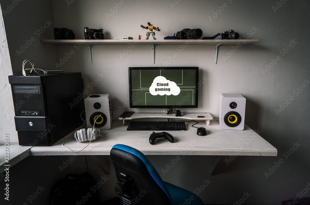 Cloud gaming: the workplace of a professional gamer with a monitor ...