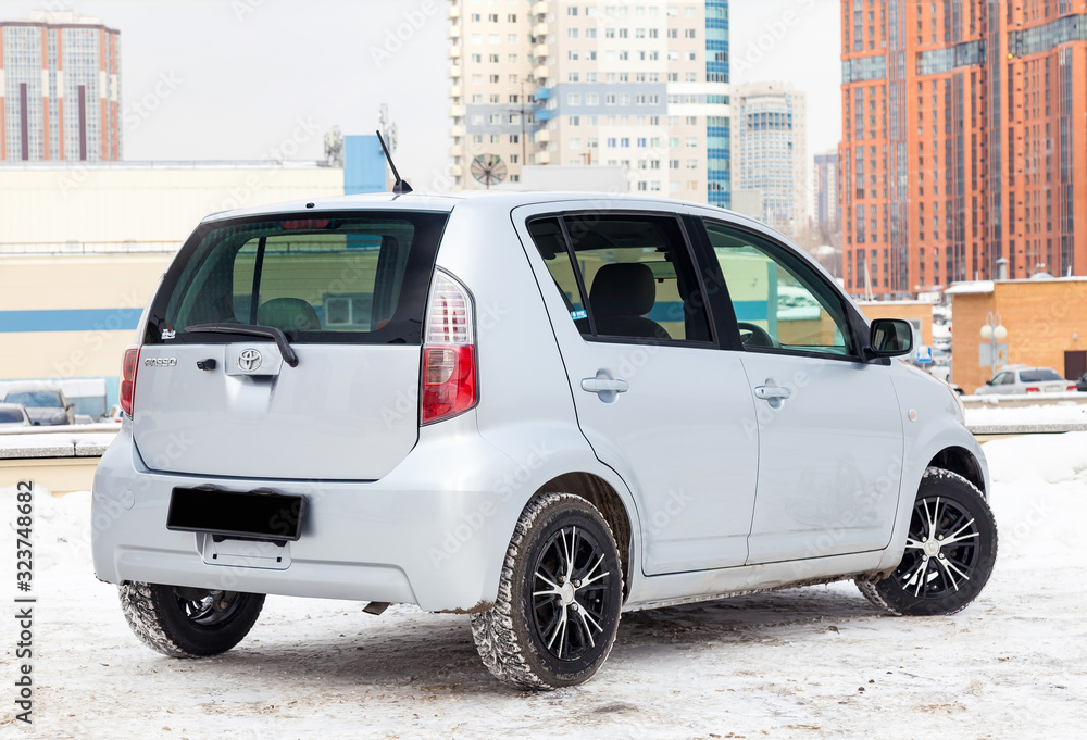 Used silver Toyota Passo with an engine of 1.3 liters rear view on the ...