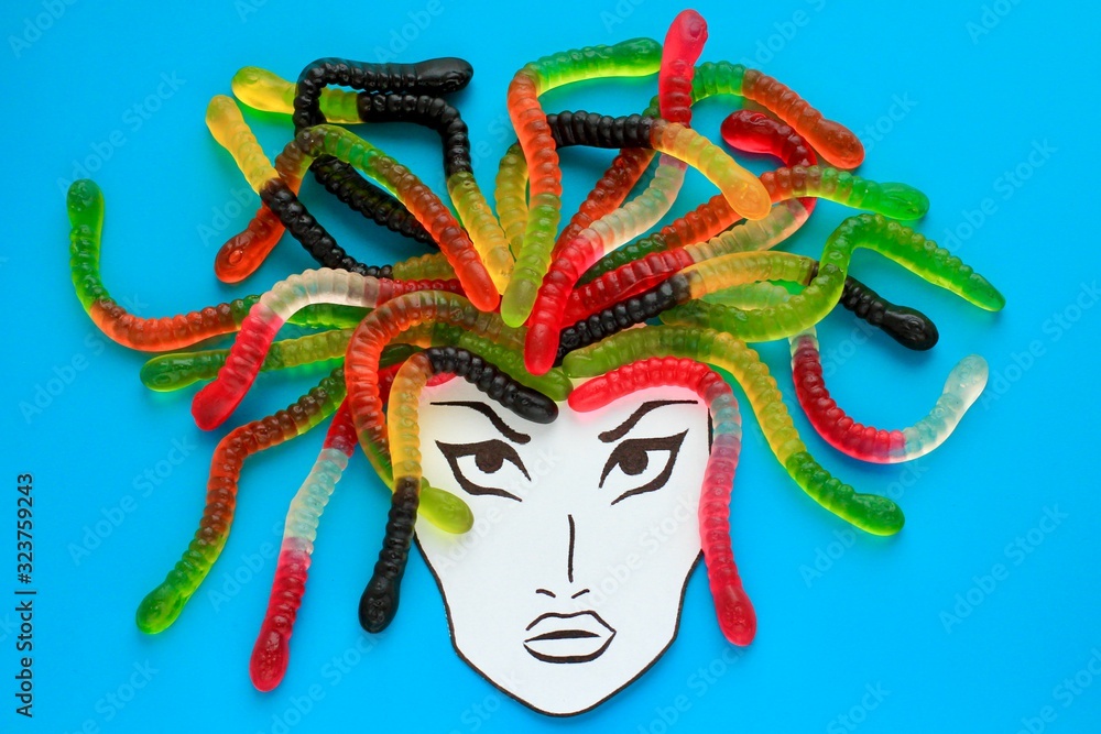Jelly worms or snakes candies lying like a woman's or a Gorgon's Medusa ...