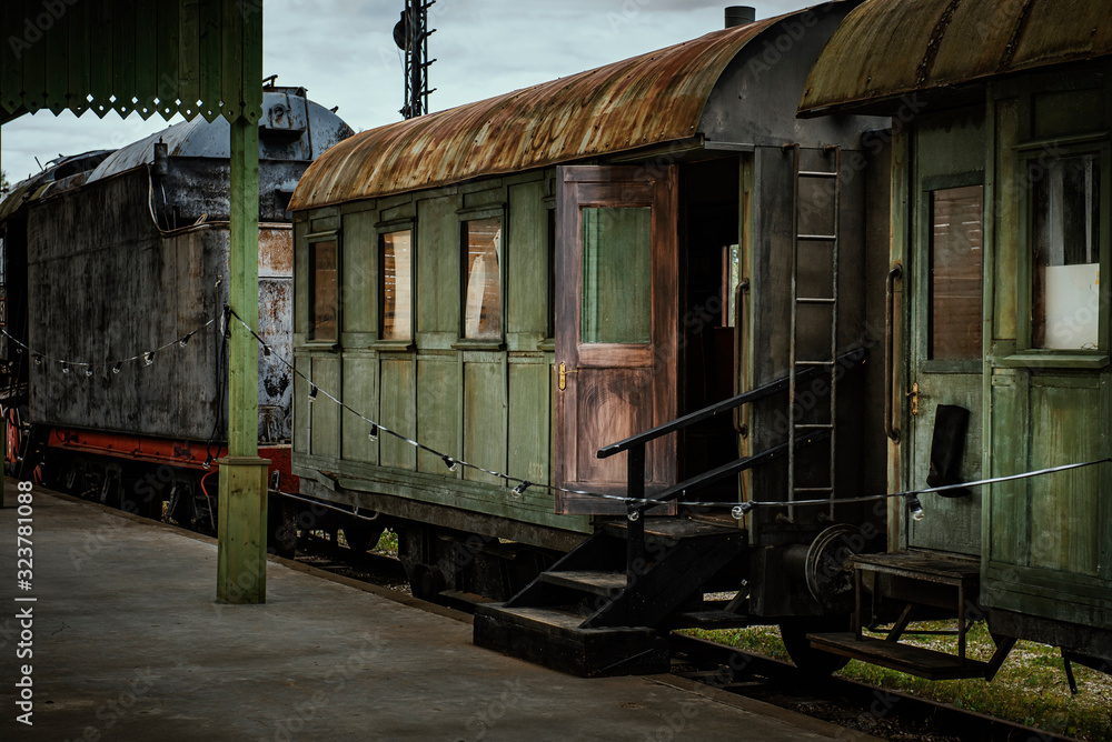 Vintage train platform with old trains and wooden buildings Stock Photo ...
