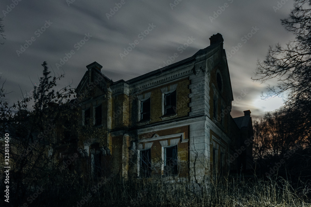 Dark and creepy old abandoned haunted mansion at night. Former Karl von ...