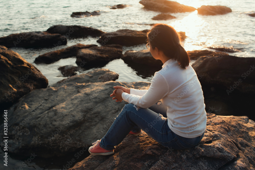 Beautiful women sitting alone and lonely Stock Photo | Adobe Stock