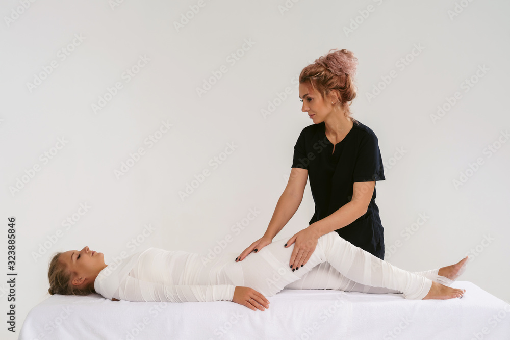 Anti-cellulite procedure of styx wrapping and banding. Young sexy slim ...