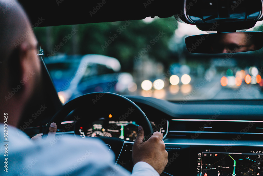 Selective focus on automotive cockpit with dashboard during wheeling on ...