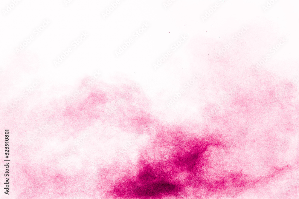 Abstract deep pink powder explosion on white background. Freeze motion ...