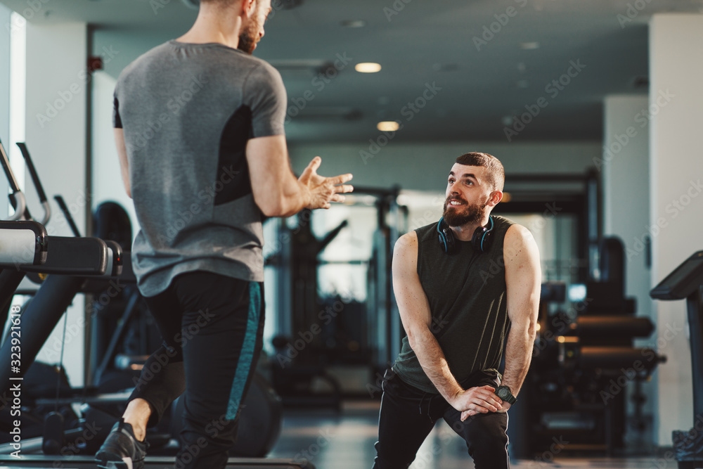 Two Handsome young man have have a conversation at the gym Stock Photo ...