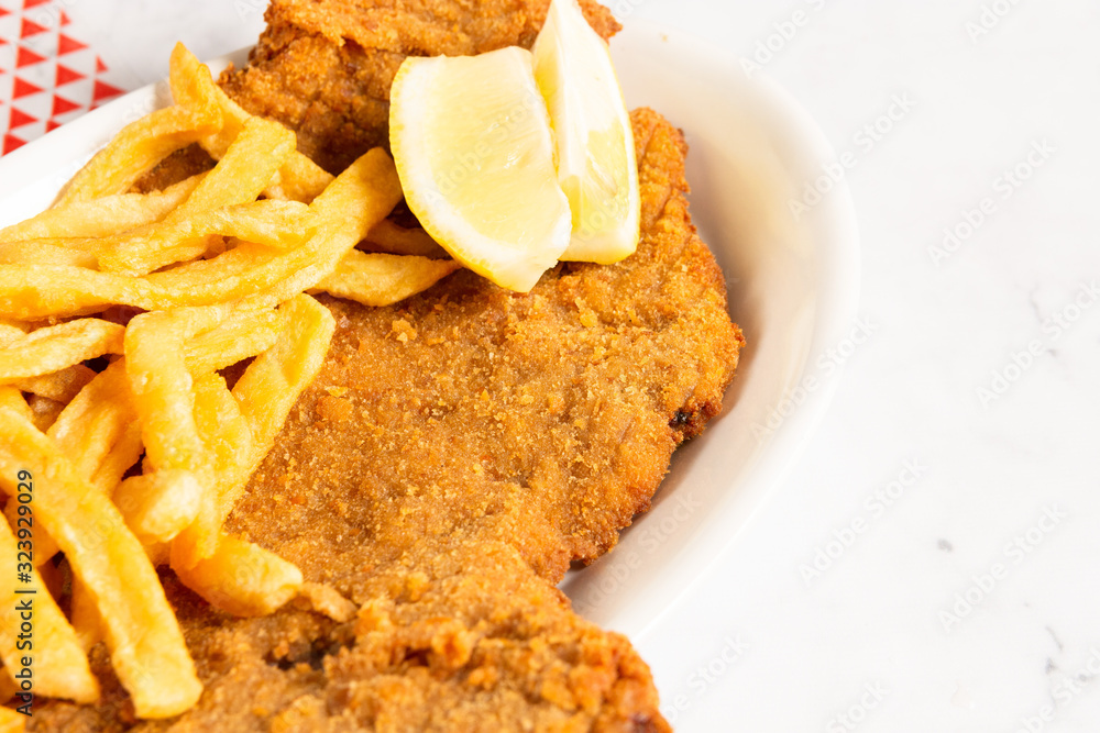 milanesa con papas fritas Stock Photo | Adobe Stock