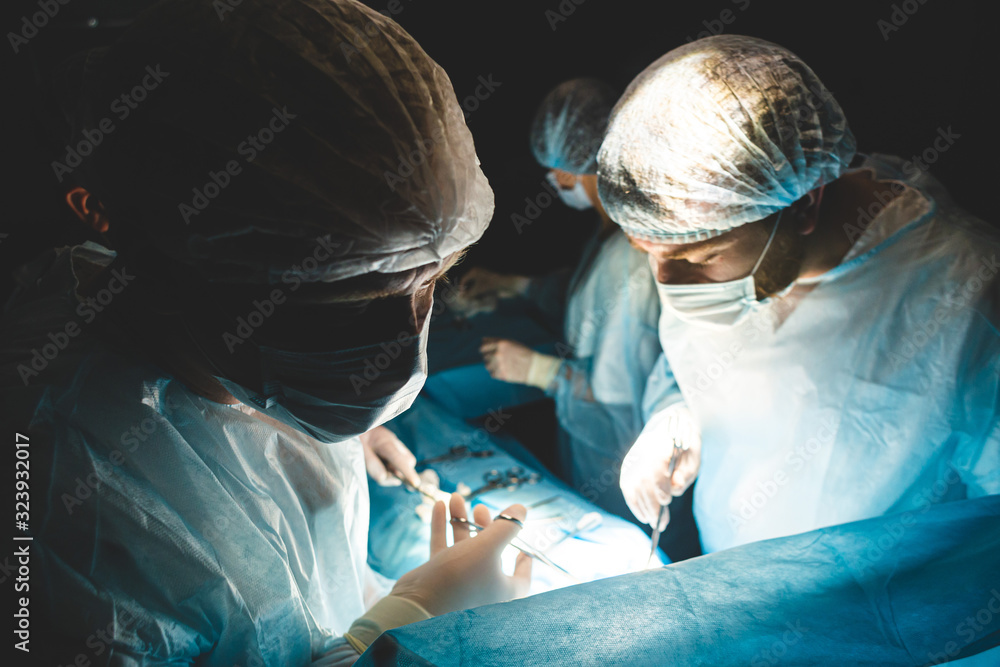 An international professional team of surgeon, assistants and ...