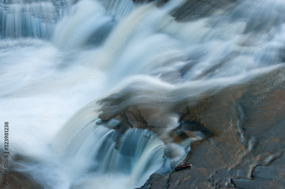 Landscape of Manido Falls captured with motion blur, Presque Isle River ...