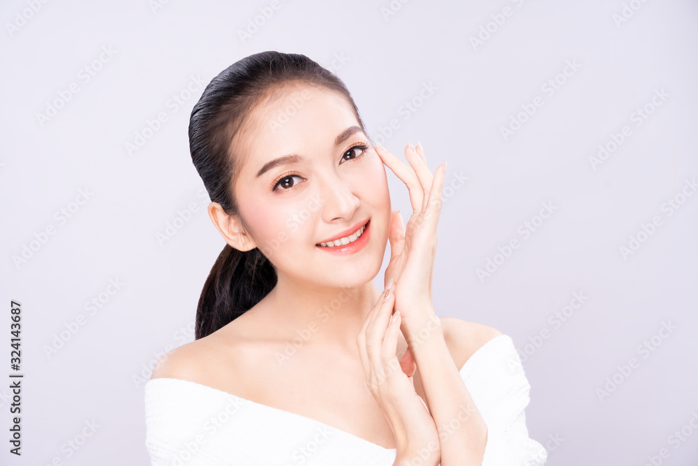 Beautiful Young Asian woman with clean fresh white skin touching her ...