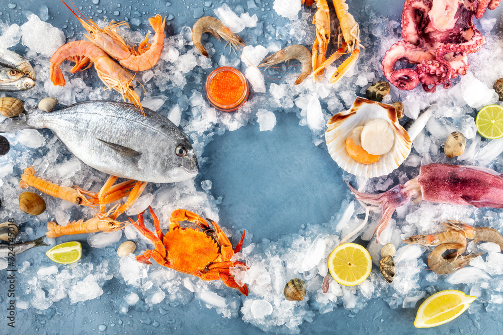 Fish and seafood background with a frame for copy space, a flat lay top ...