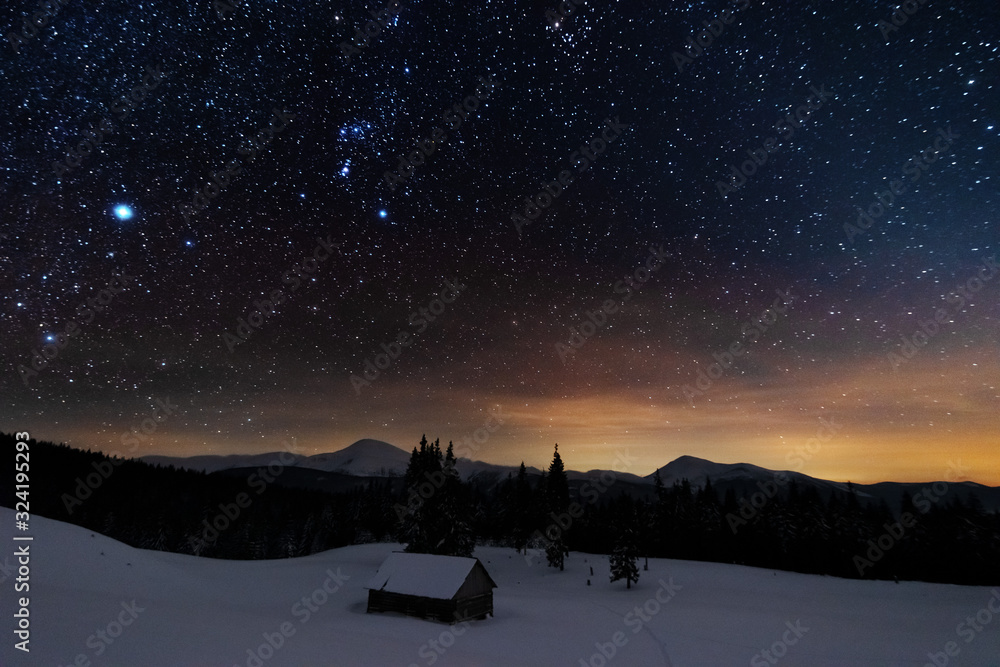 A bright starry night in the mountains with the Milky Way in the sky ...