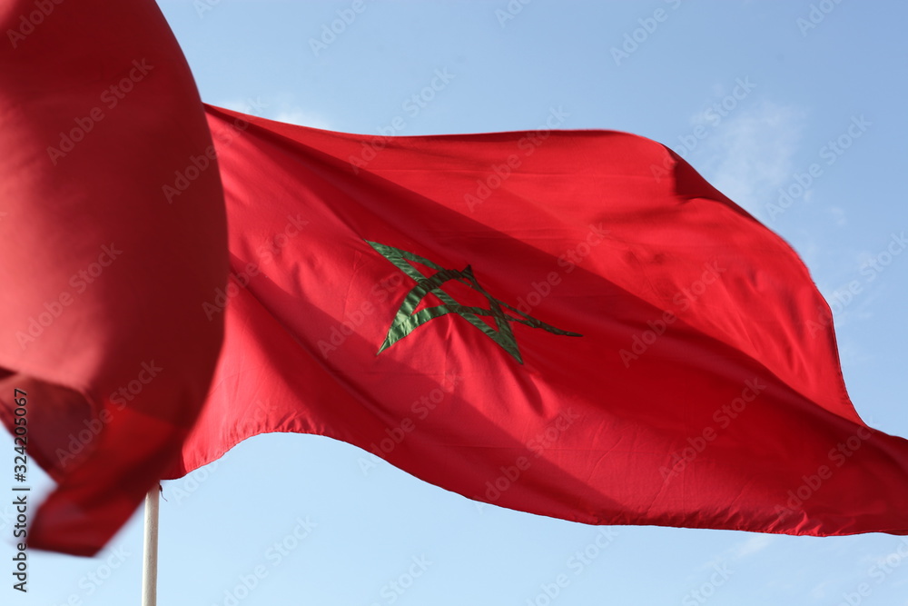 Bandera de Marruecos con cielo azul de fondo Stock Photo | Adobe Stock