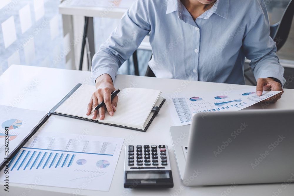 Professional at work, business woman working and analyzing on laptop ...