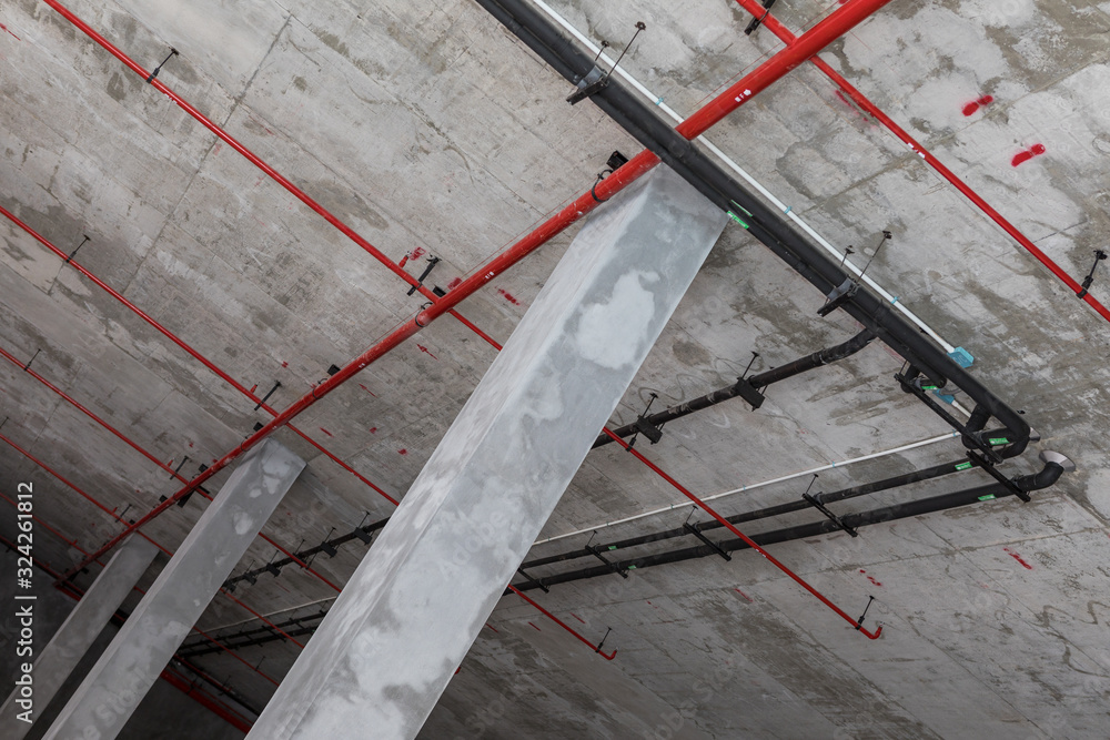 Fire protection system installation on bare skin ceiling. Stock Photo ...