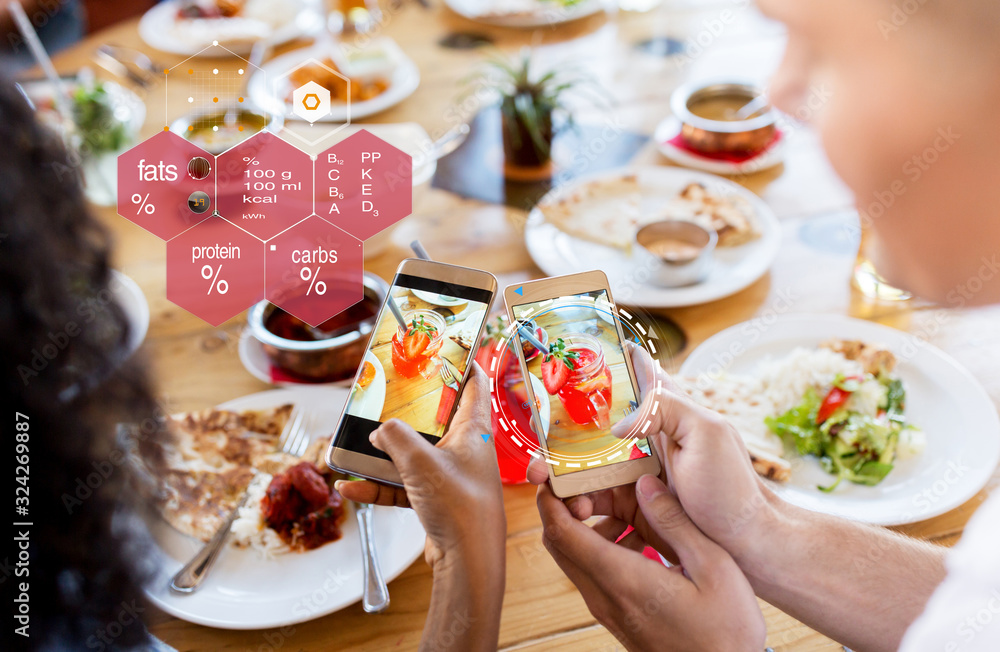 technology, eating and people concept - hands of couple with cocktail ...