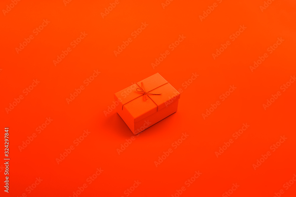 Gift box in an orange colour background, minimalism design, idea ...