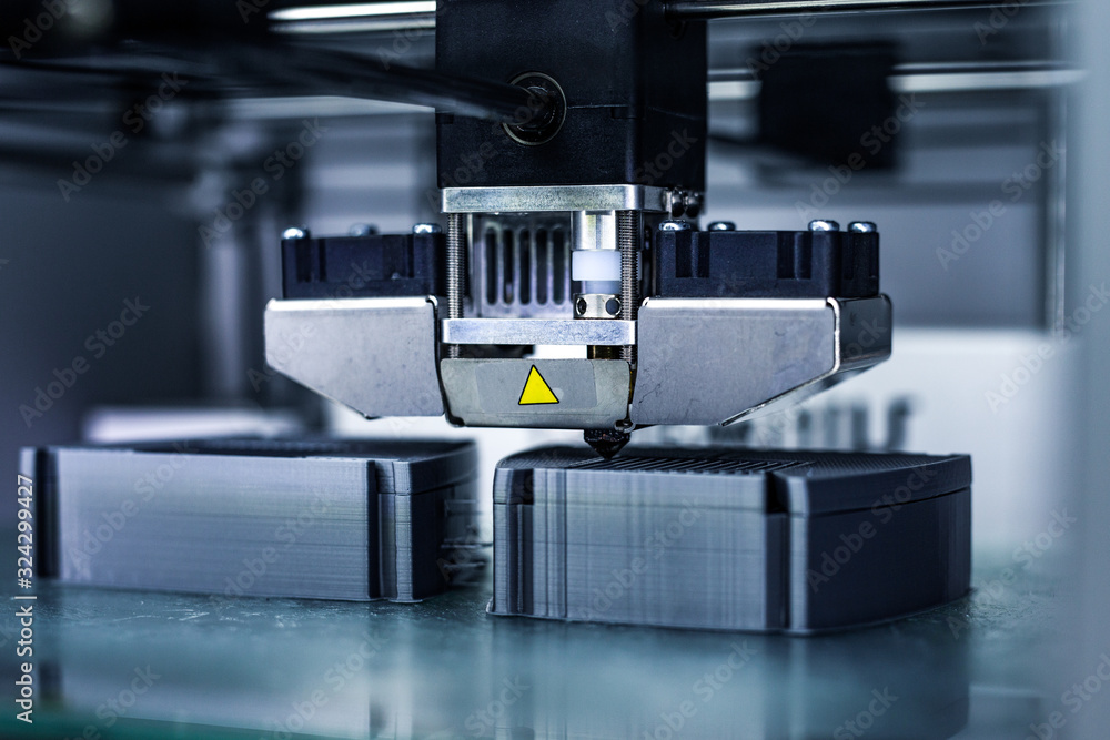 Modern technical 3D printing. Electronic three dimensional plastic ...
