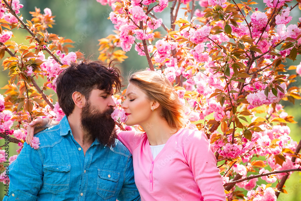 Kissing couple in spring nature close-up portrait. Smiling couple in ...