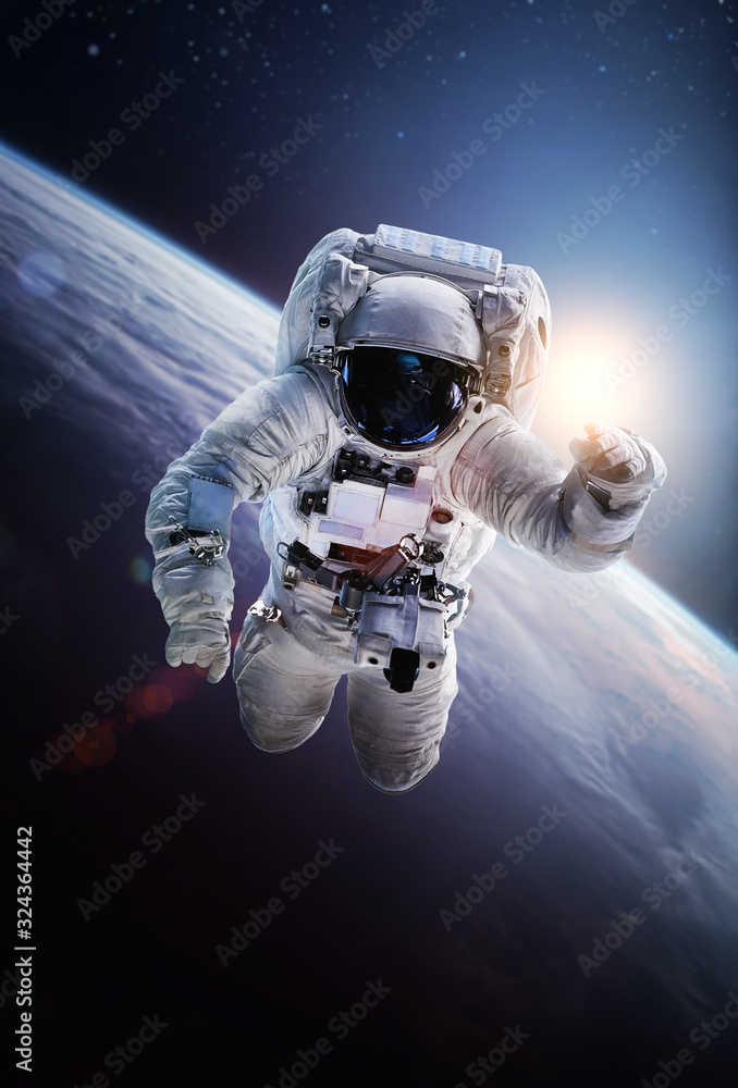 Astronaut in the outer space on orbit of the planet Earth. Abstract ...