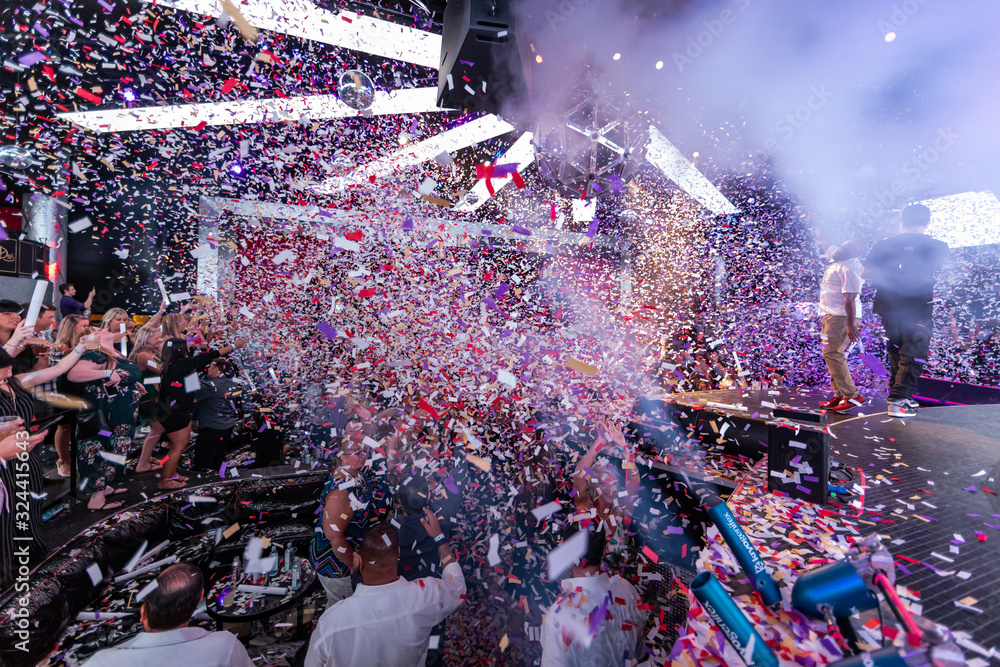 Party with confetti and smoke being shot out of canons Stock Photo ...