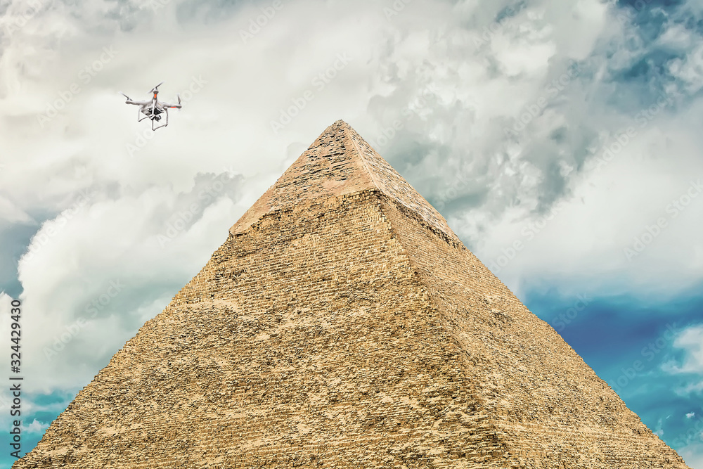 Fotka „Quadcopter rises into the air to make a movie pyramid . The ...