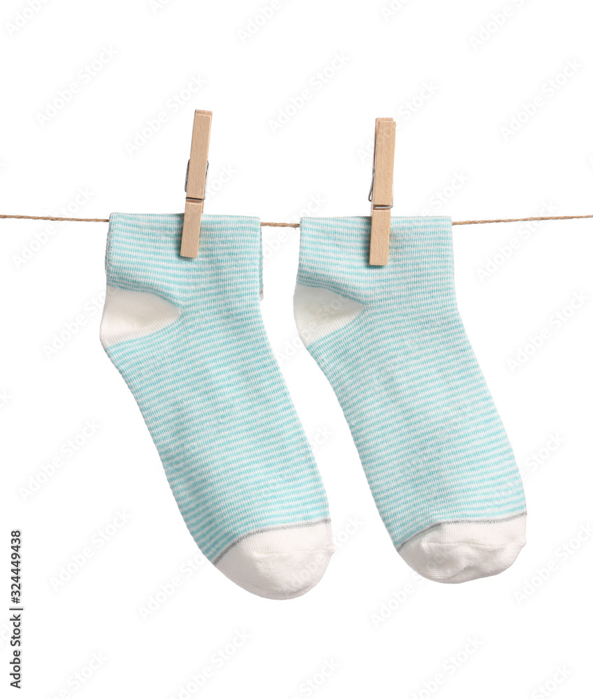 Cotton socks hanging on rope against white background Stock Photo ...