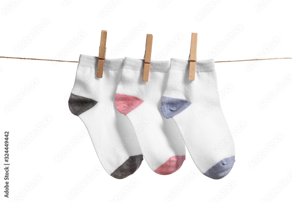 Cotton socks hanging on rope against white background Stock Photo ...