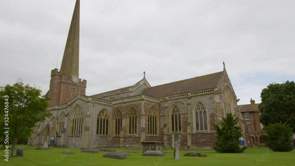Medium low angle still shot of St Mary's Church building with a steeple ...
