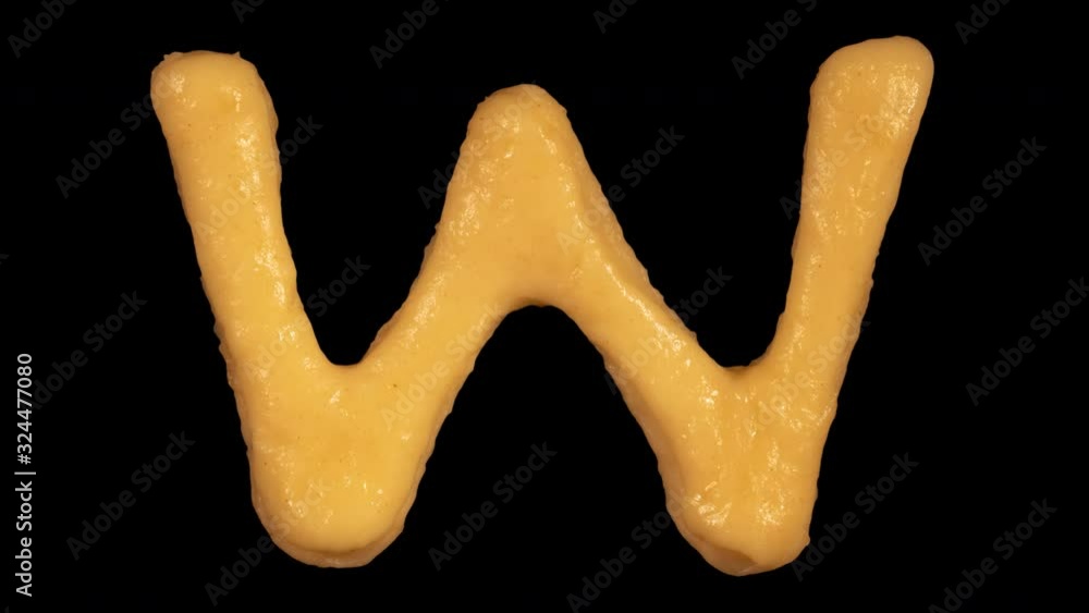 Vidéo Stock Cookie letter W, baking time lapse, top view, include two ...