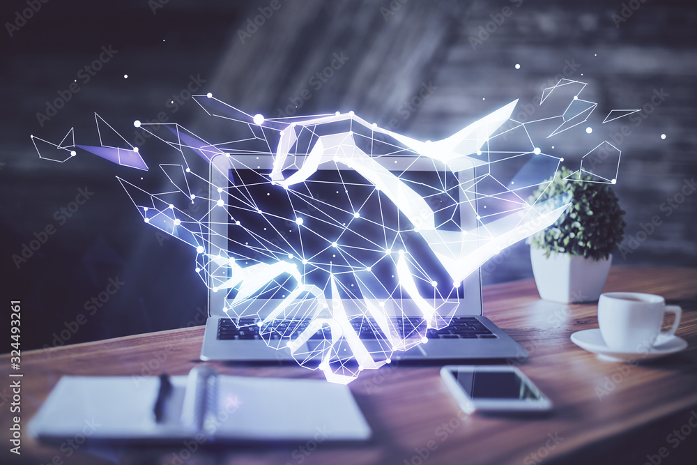Desktop computer background in office and handshake hologram drawing ...