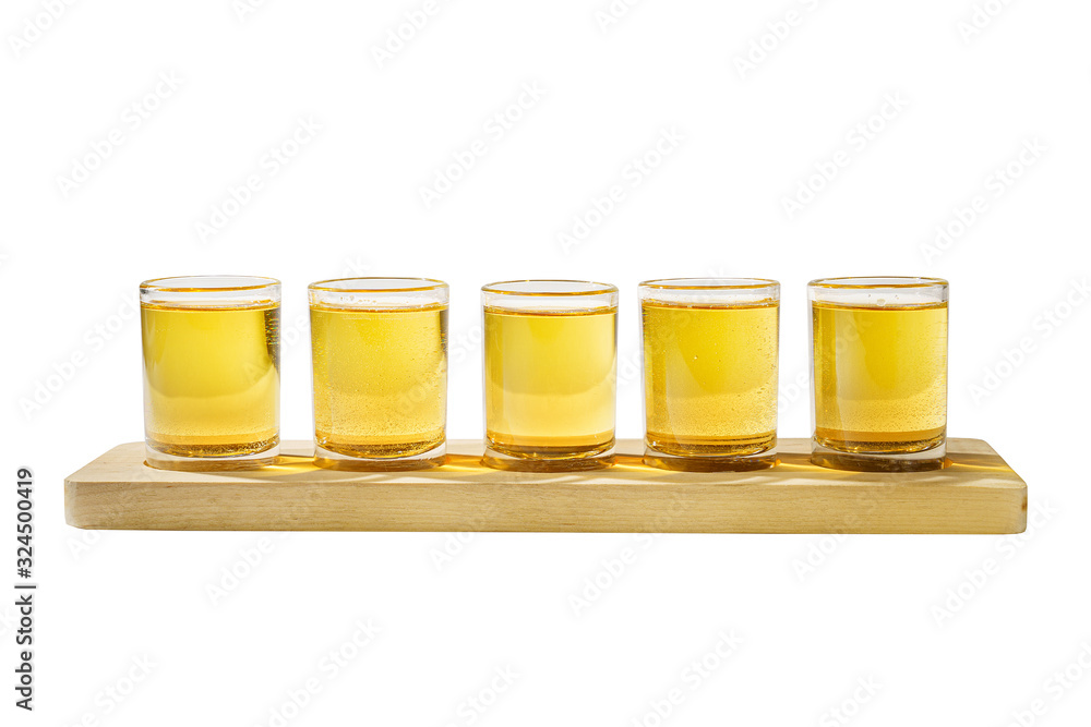 Yellow, same color opaque cocktails, a set of shots in one row, five ...