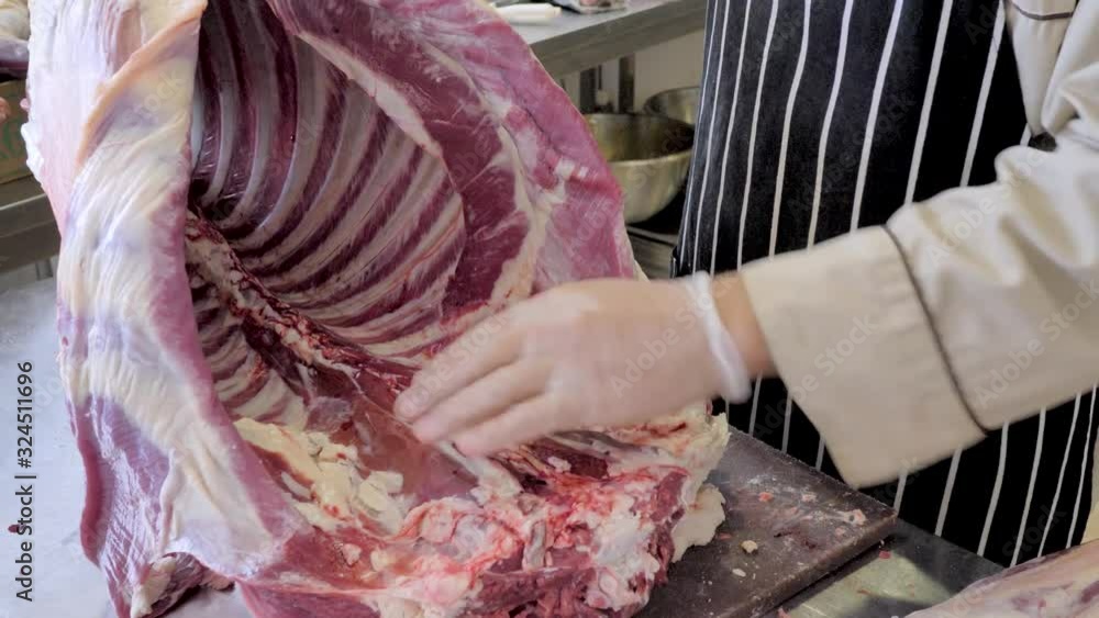 Butcher cut sheep meat. Make a sacrifice of a sheep on Kurban bayram ...