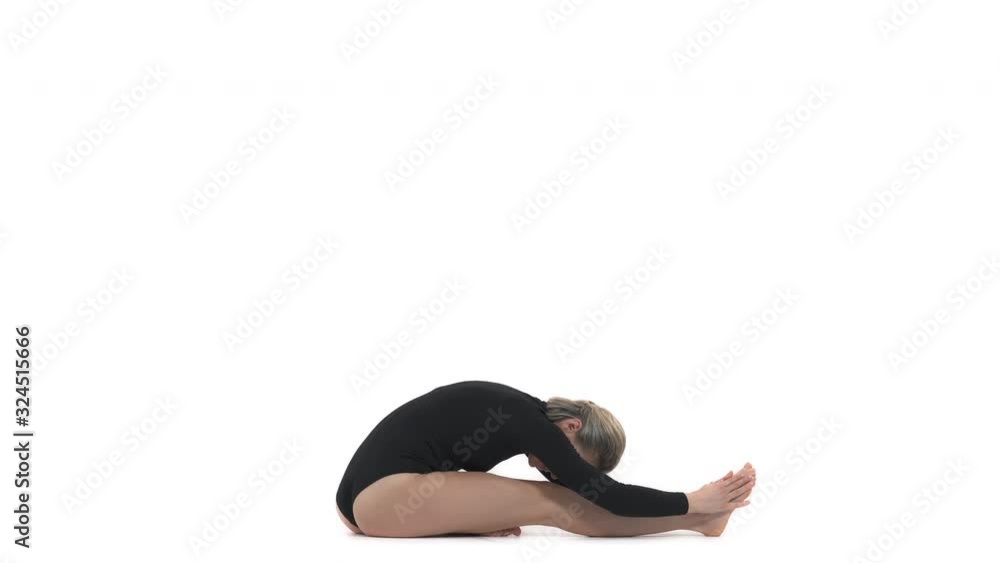Yoga mat woman stretching hip, hamstring muscles and groin area ...