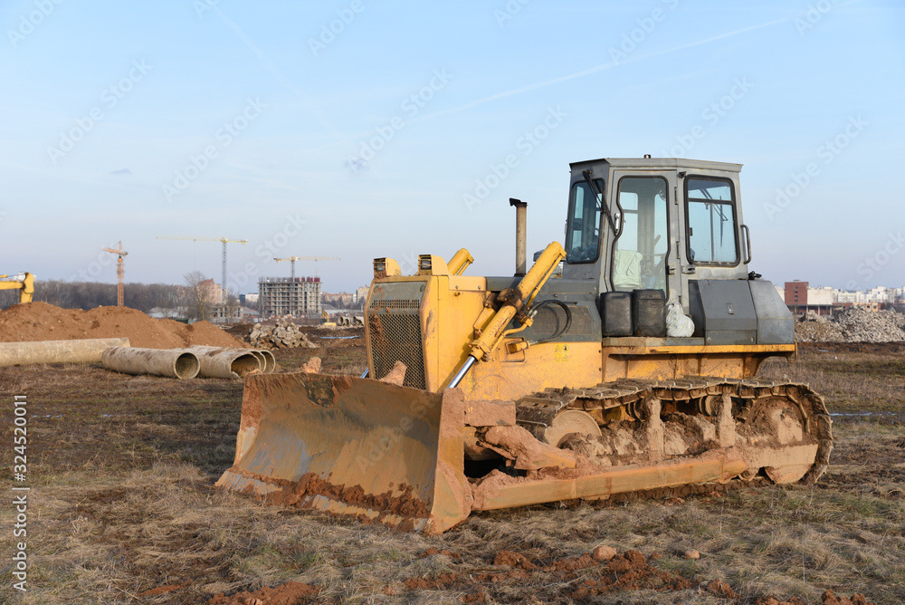 Bulldozer at construction site. Heavy equipment for digging, demolition ...