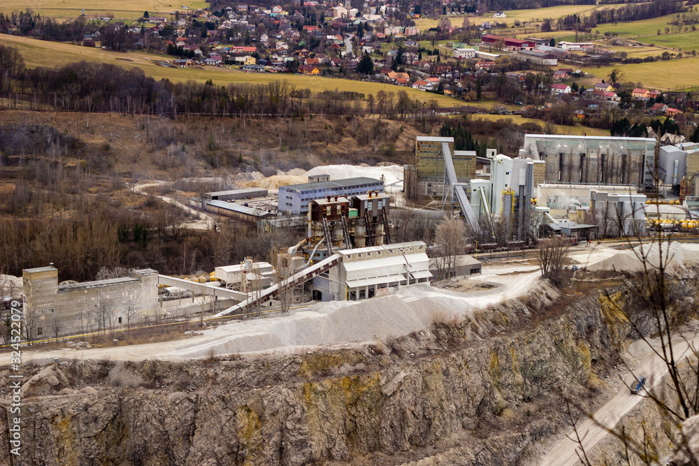 Panorama of the giant limestone pit. Thousands birches on the cliffs ...