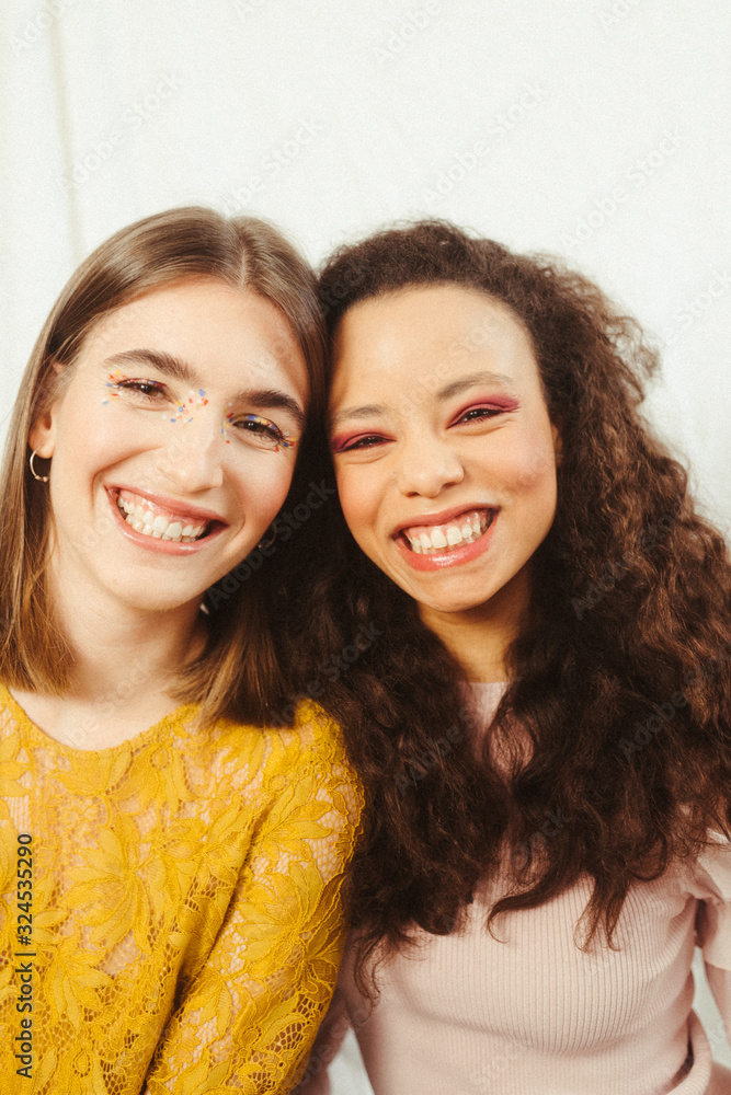 portraits girls with different skin tones in colorful outfits smiling ...