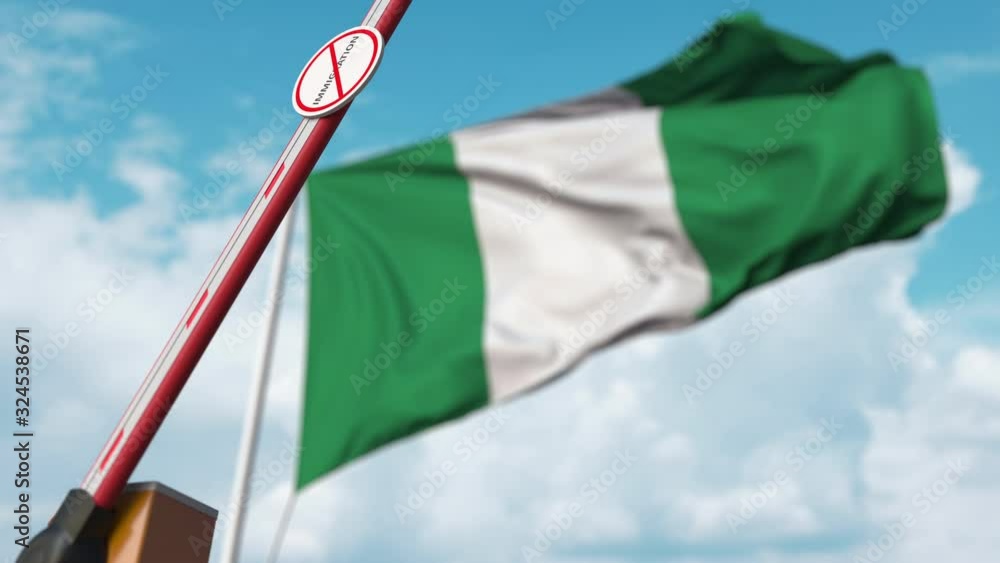 Vidéo Stock Opening boom barrier with stop immigration sign against the ...