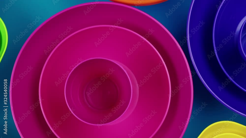 multi colored plates on a blue background. Conceptual, abstract ...