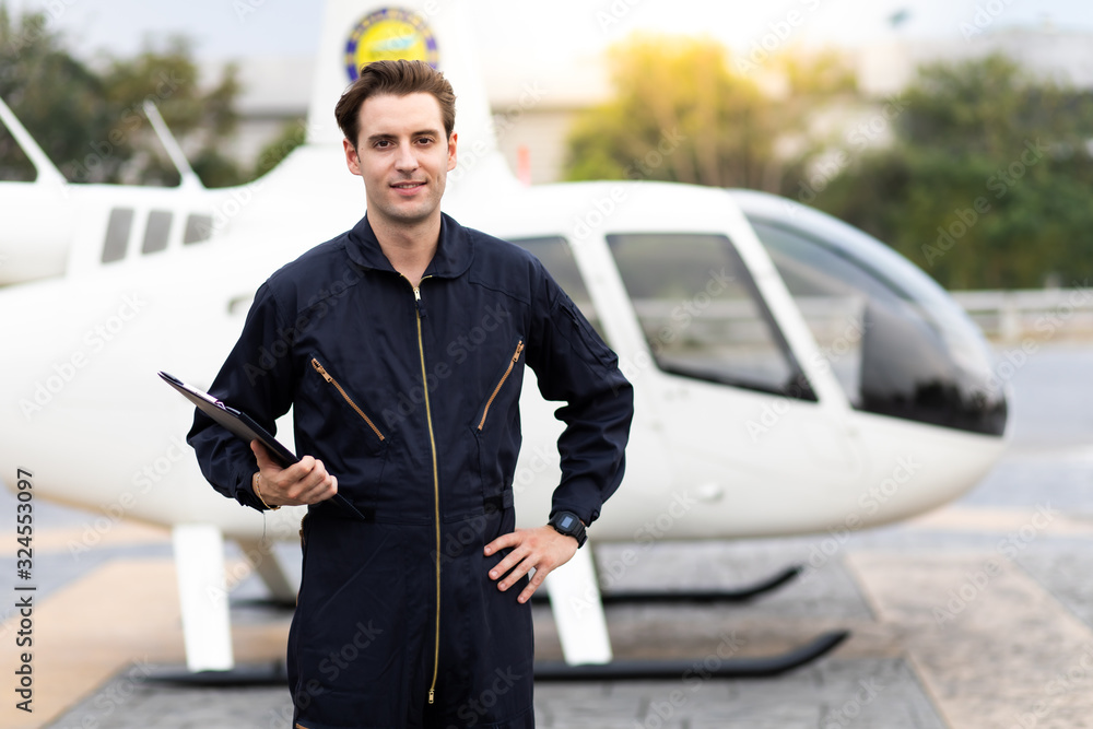Engineer maintaining a helicopter Engine. Male engine machanic ...