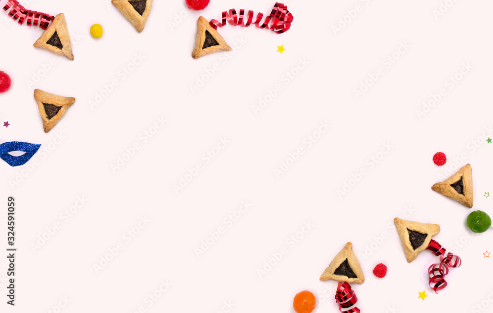Frame of triangular cookies ( hamantasch or aman ears ), candy, mask ...