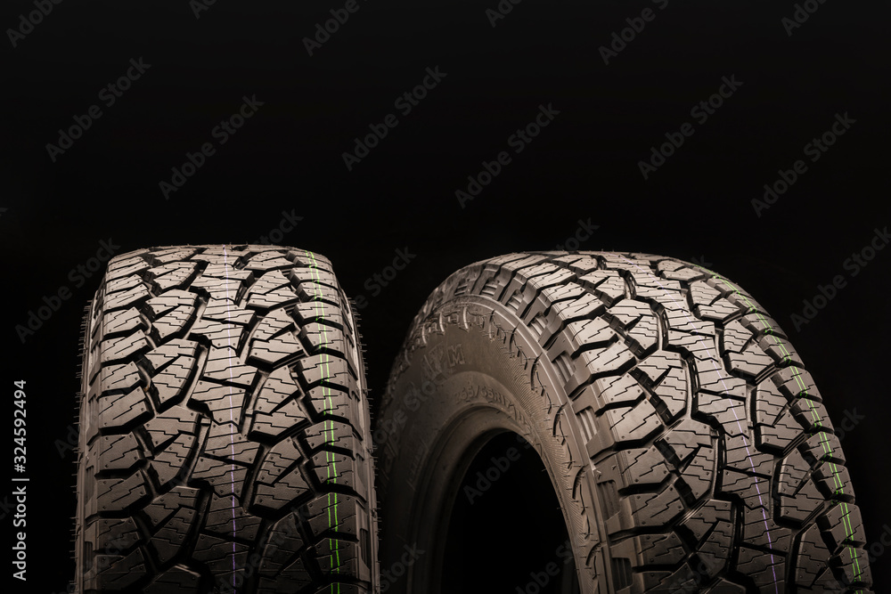 two off-road wheels with a powerful tread, mud pattern with slats, cuts ...