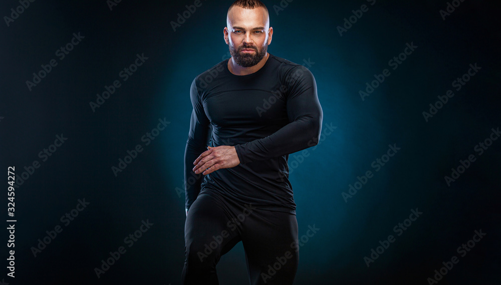 Muscular young fitness sports man athlete in compression garment ...