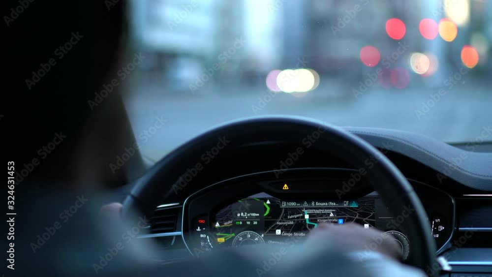 Cropped back view of male person steering automobile holding hand on ...
