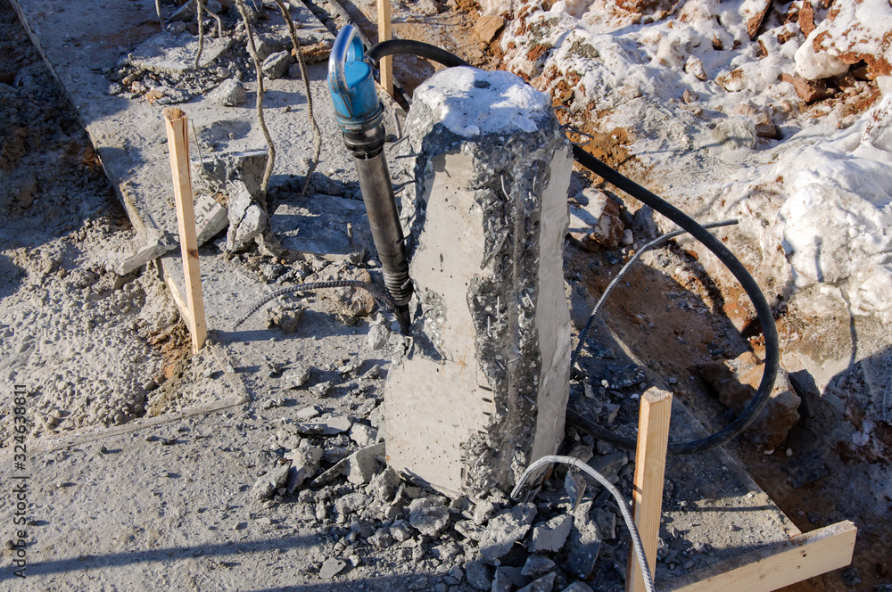 Demolition of concrete piles. Concrete base of the new building. Stock ...
