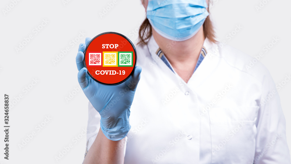 Female doctor hand holding stop sign with text stop COVID-19 and QR ...