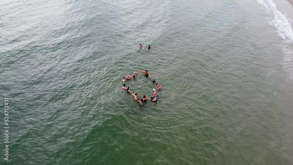 An aerial view over people in the freezing cold waters of the Atlantic ...