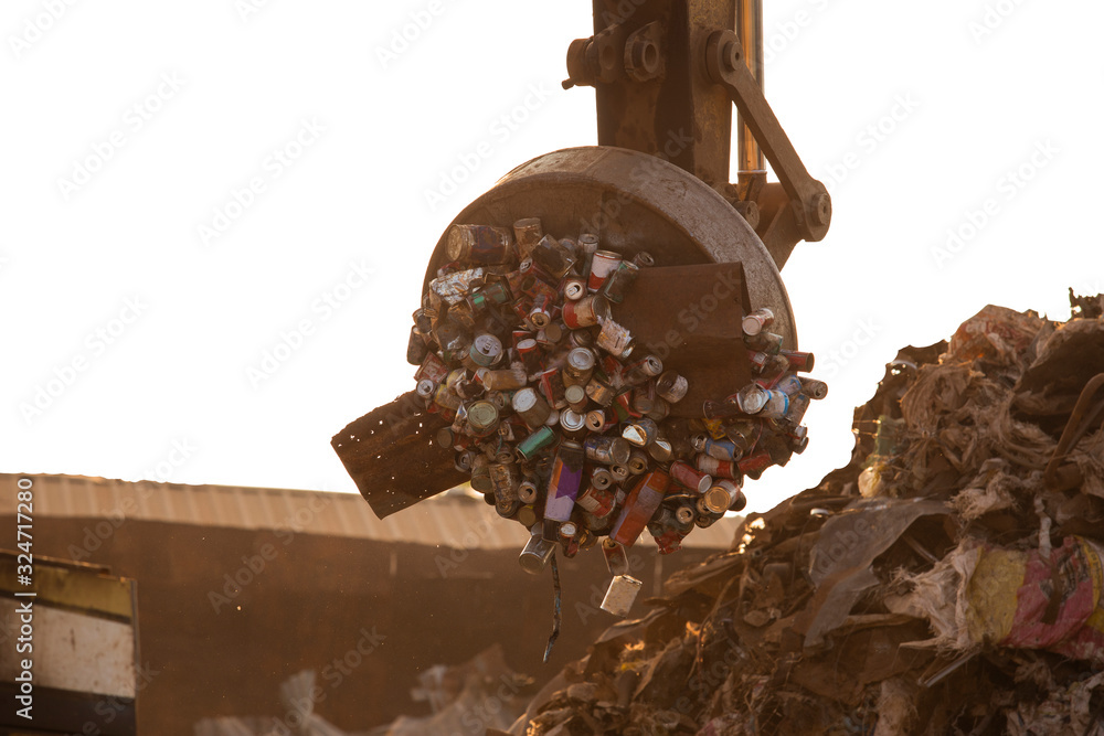 garbage isolated on the white background,Backhoe use electromagnets ...