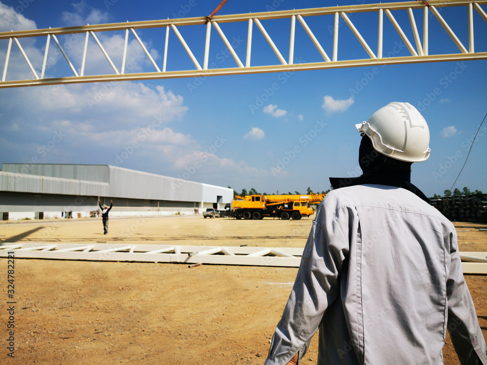 foreman is controlling mobile crane for installation steel truss, Roof ...