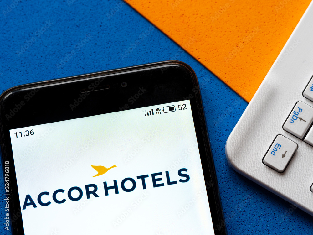 In this photo illustration the Accor Hotels logo is seen displayed on a smartphone Stock Photo ...